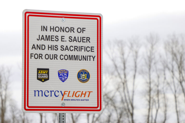 Memorial road signs in Riga and Chili honor Mercy Flight pilot James ...